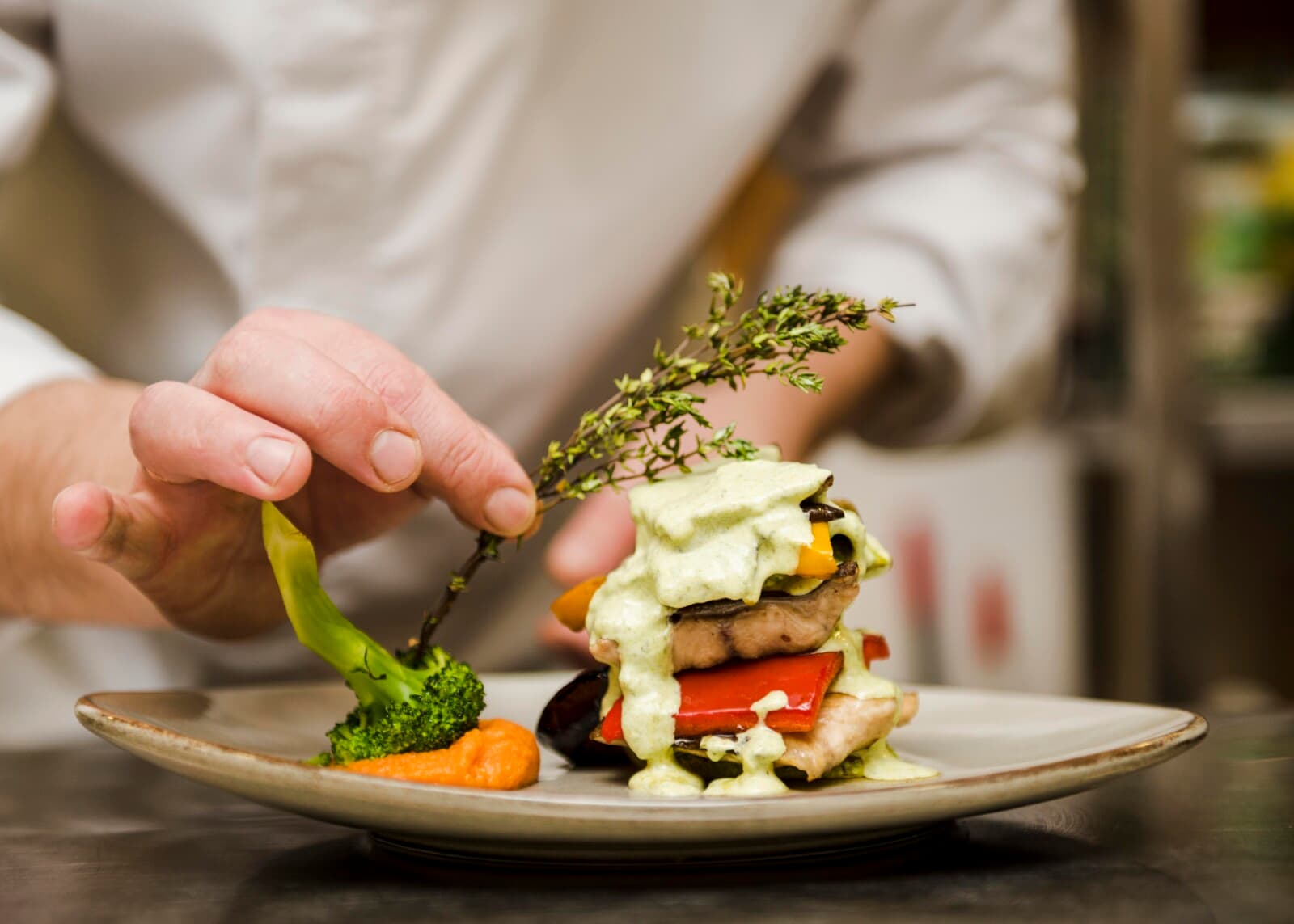 chef-placing-herb-gourmet-meal - greenery.